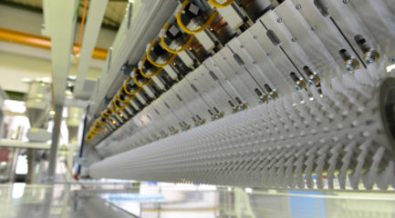 Granule scattering machine with rotary brush system - IPCO